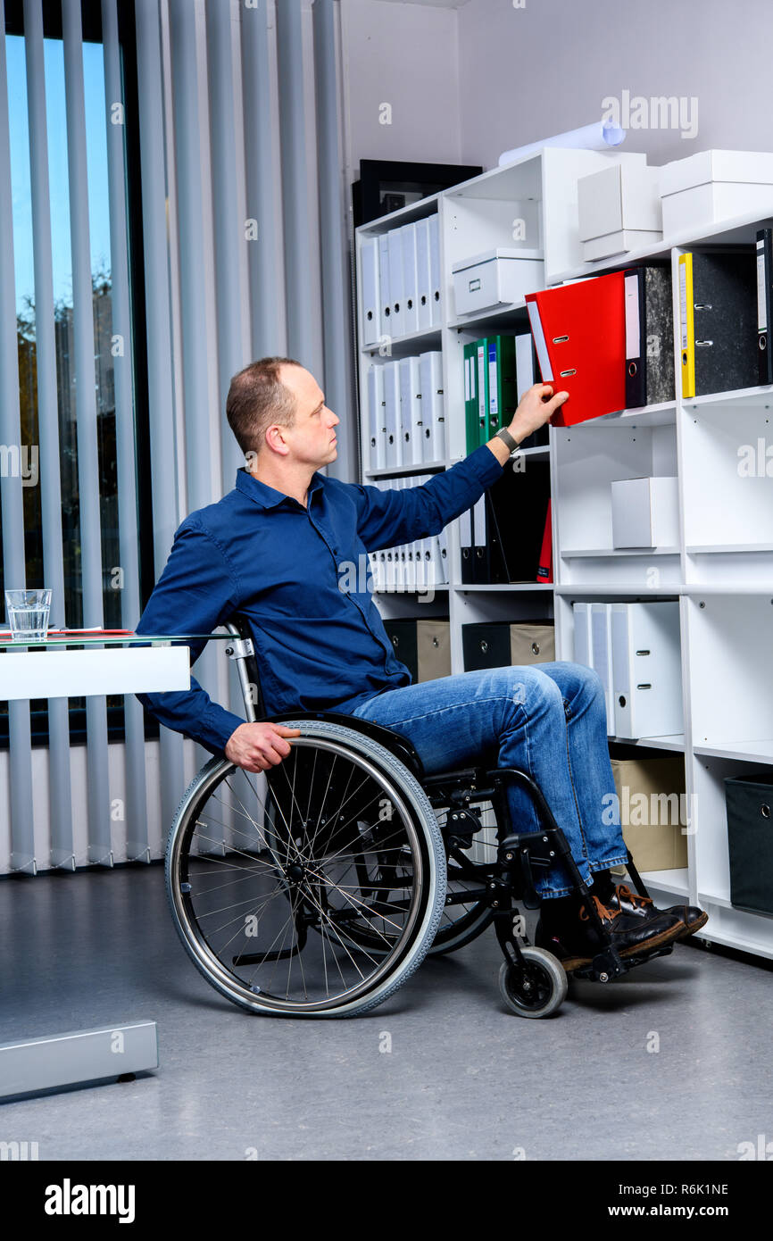 disabled business in wheelchair Stock Photo - Alamy