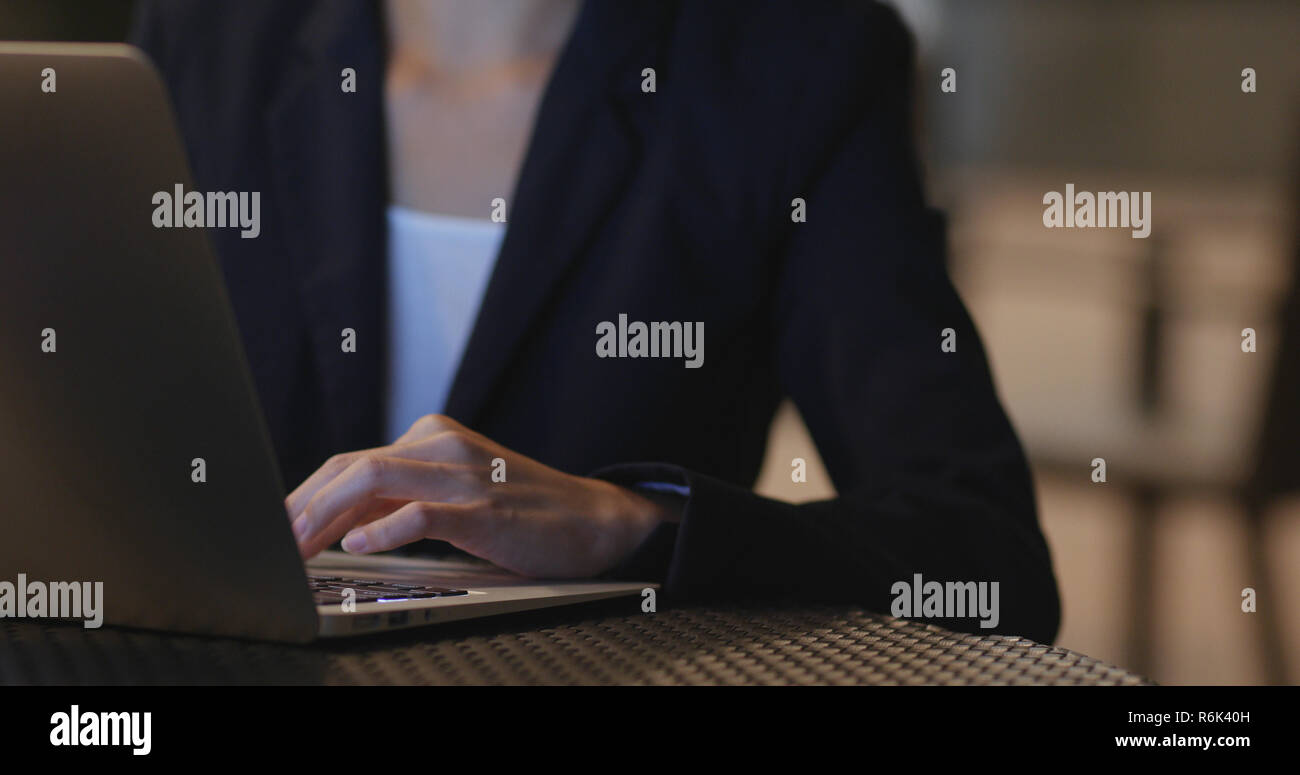 Businesswoman use of laptop computer at night Stock Photo - Alamy