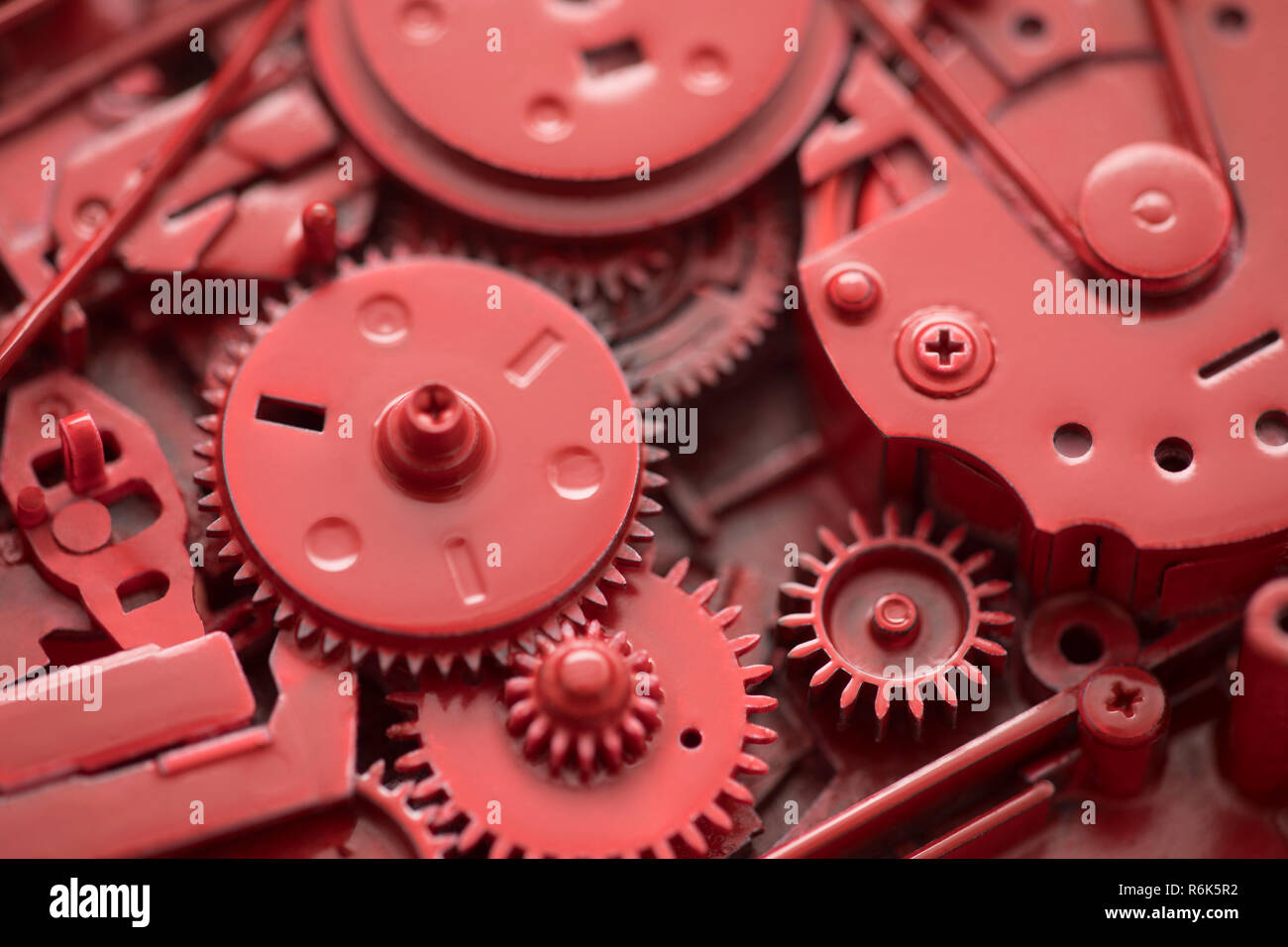 Red gears and cogs macro shot, industrial background Stock Photo - Alamy