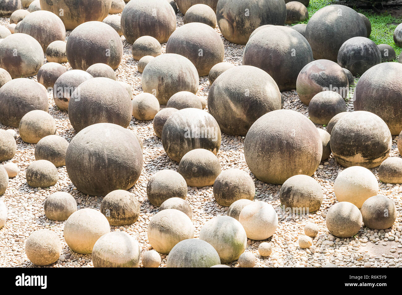 Stone sphere in garden Stock Photo - Alamy