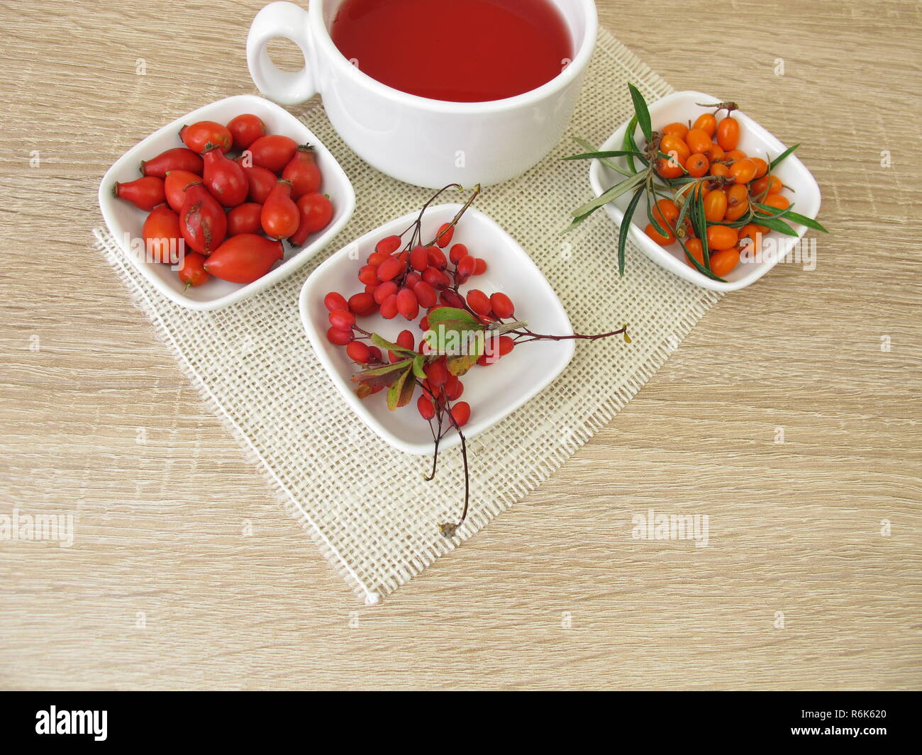 red fruit tea with rosehip,sea buckthorn and barberry Stock Photo - Alamy