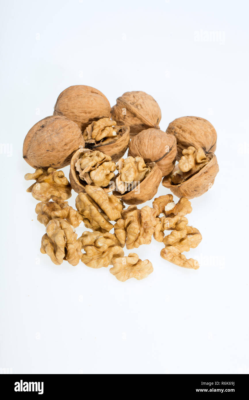 walnut and a cracked walnut isolated Stock Photo - Alamy