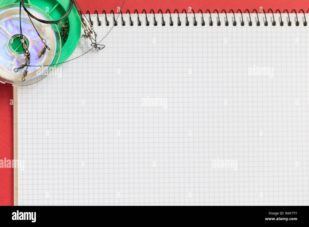 big notebook with fishing tackles on color paper background Stock Photo ...
