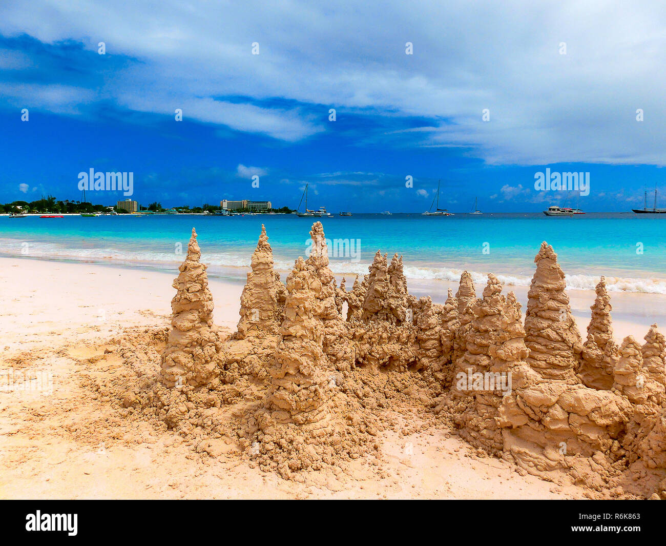 Sand castle on tropical white beach Stock Photo - Alamy