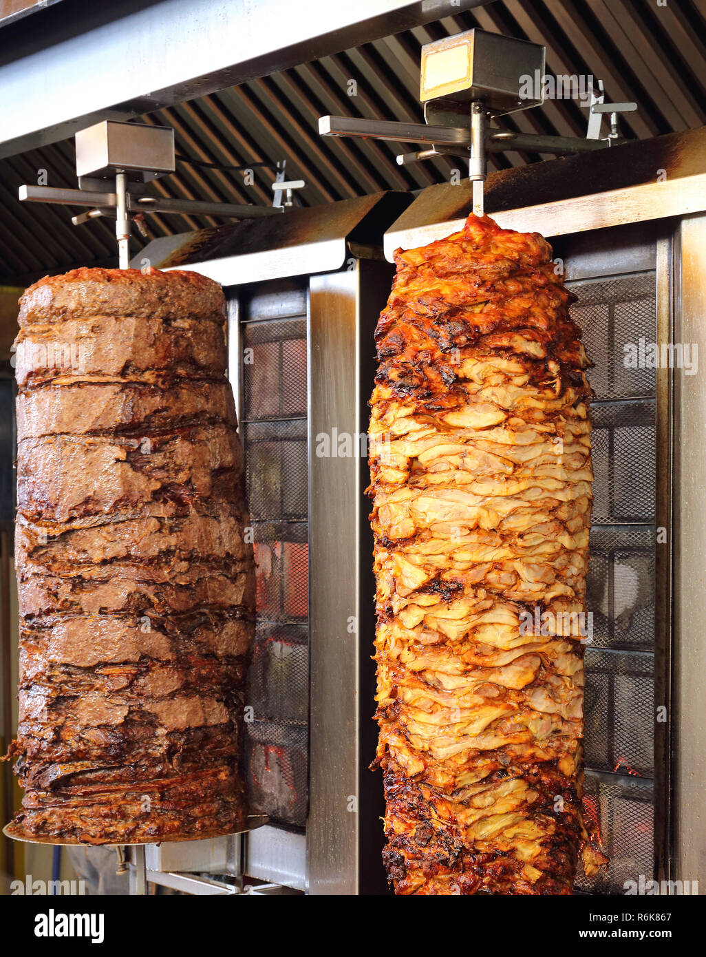 Chicken and lamb kebab at vertical grill hi-res stock photography and ...