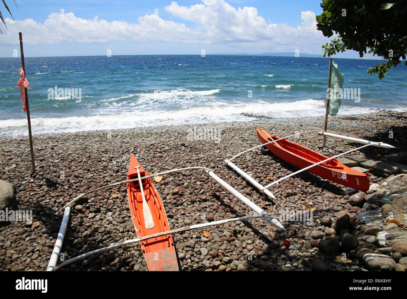 fishing boat on the pebble beach Stock Photo - Alamy