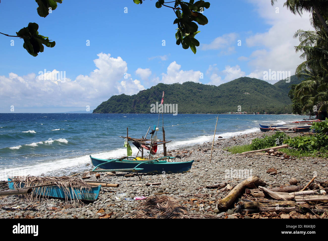 fishing boat on the pebble beach Stock Photo - Alamy