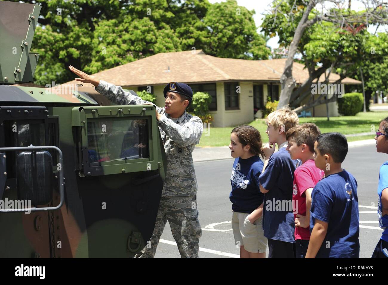 Senior Airman Jeffrey Custodio, JBSF police services clerk, shows off a ...
