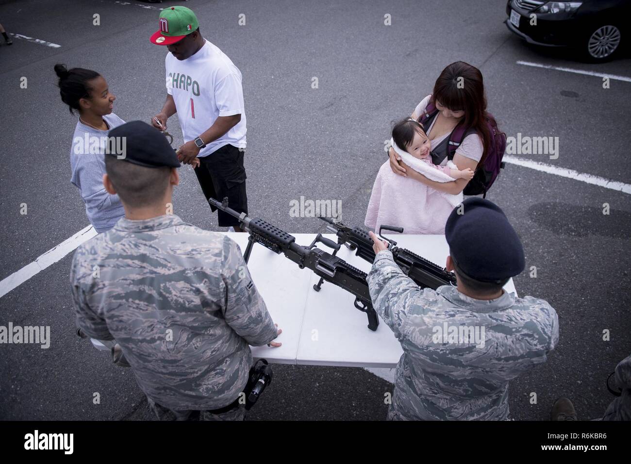 374th Security Forces Squadron members show event goers the equipment ...