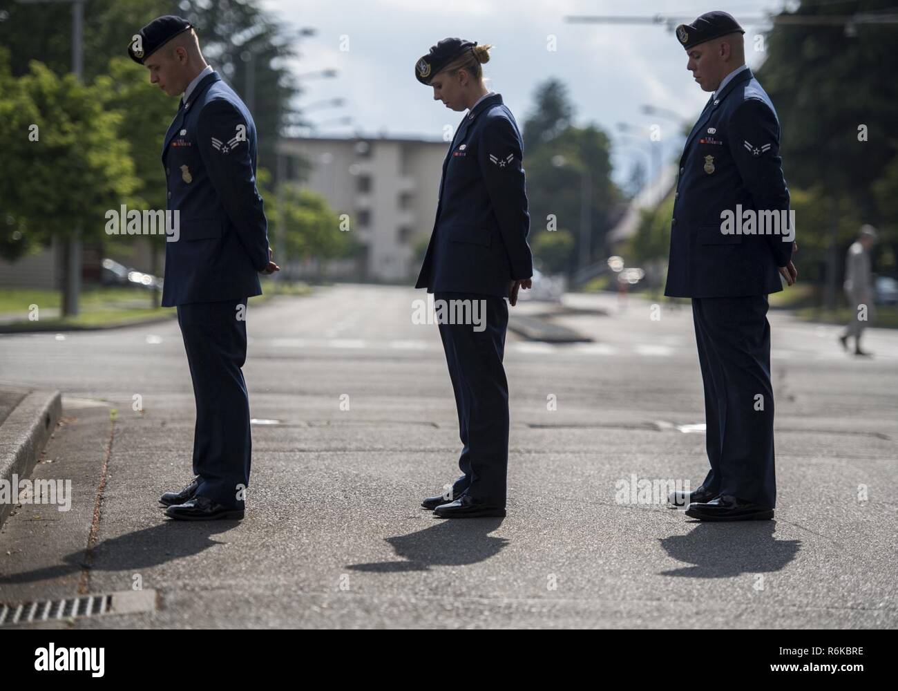 374th Security Forces Squadron members bow their heads in prayer during ...