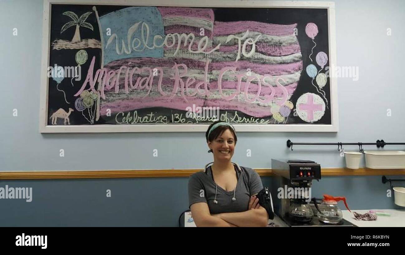 U.S. Army Capt. Kelly Bennett proudly stands in front of her chalk art ...