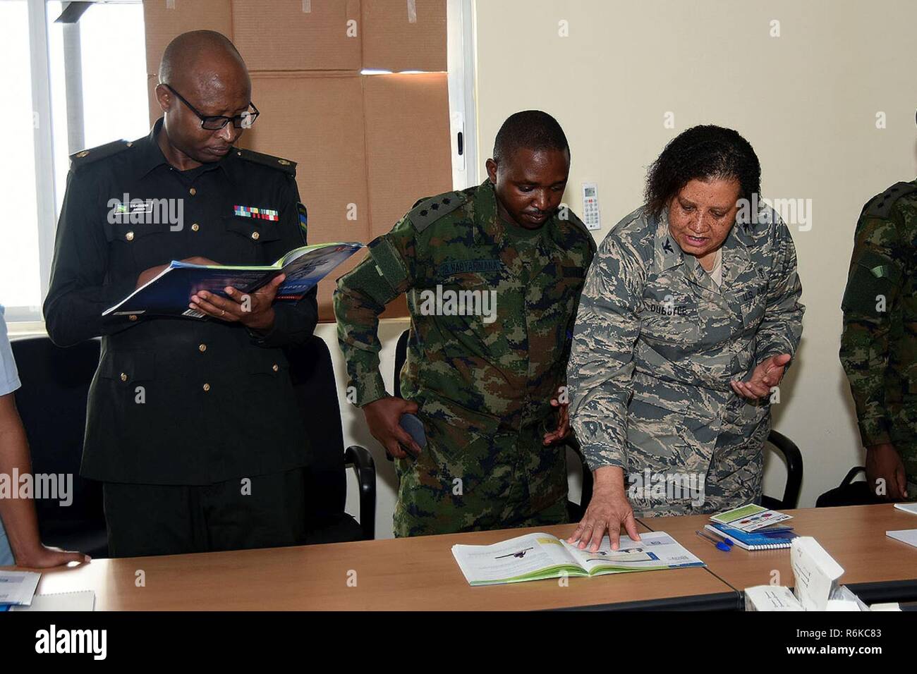 (From left to right) Major Ernest Ruririmbwa, RN, Captain Jean Bosco ...