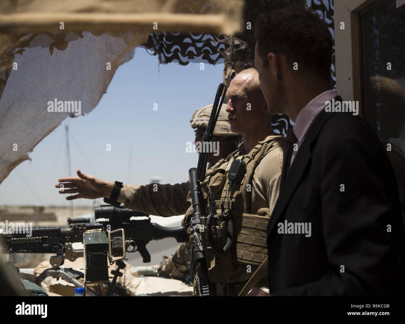 A U.S. Marine infantry officer, center, with Task Force Southwest gives ...