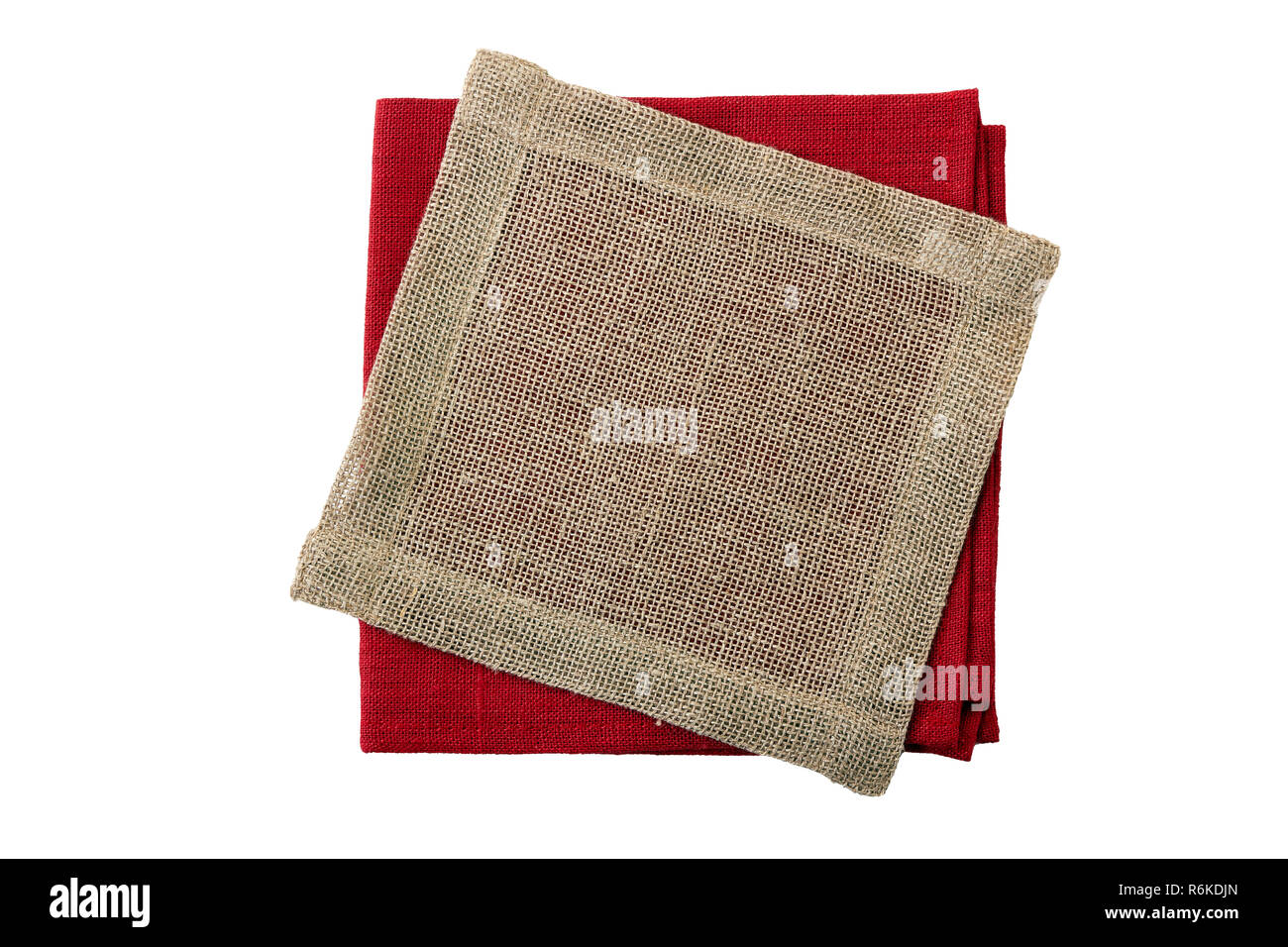 Stack of folded red and jute napkins on white Stock Photo - Alamy