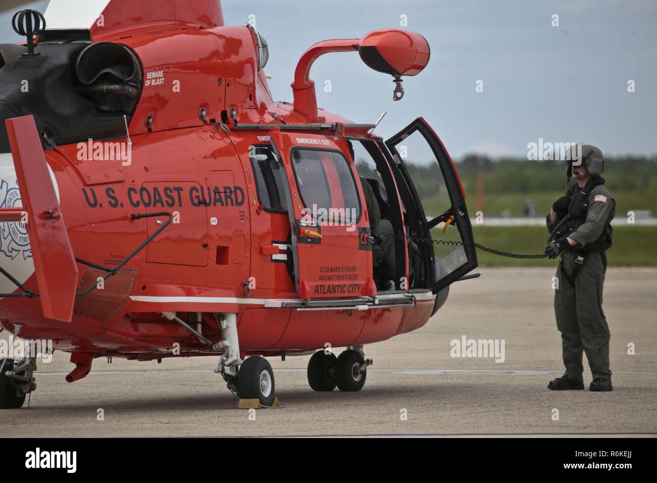 A U.S. Coast Guard HH-65C Dolphin crew chief from Coast Guard Air ...
