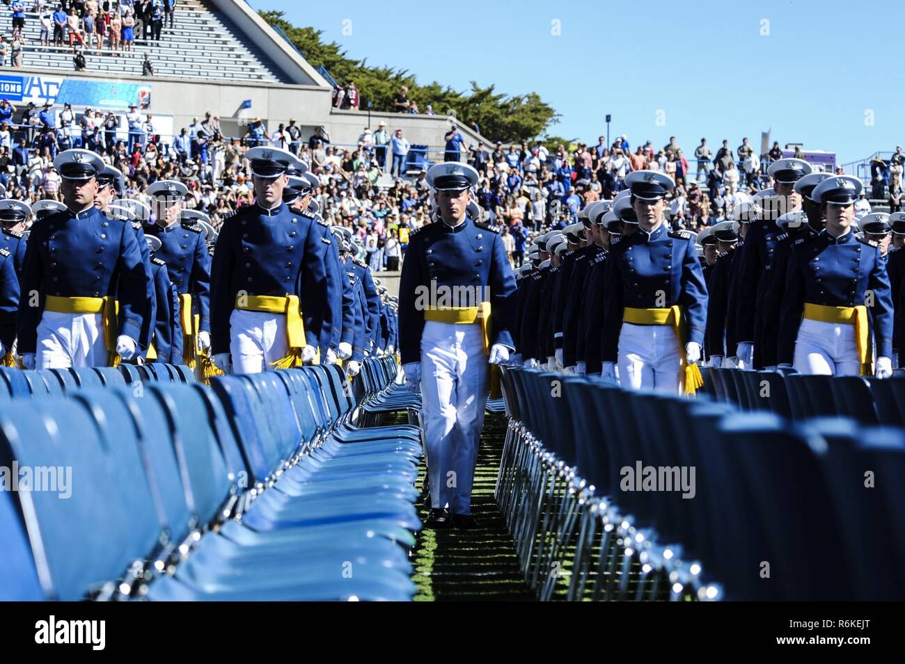 Graduates march to their seats during the graduation ceremony at the ...