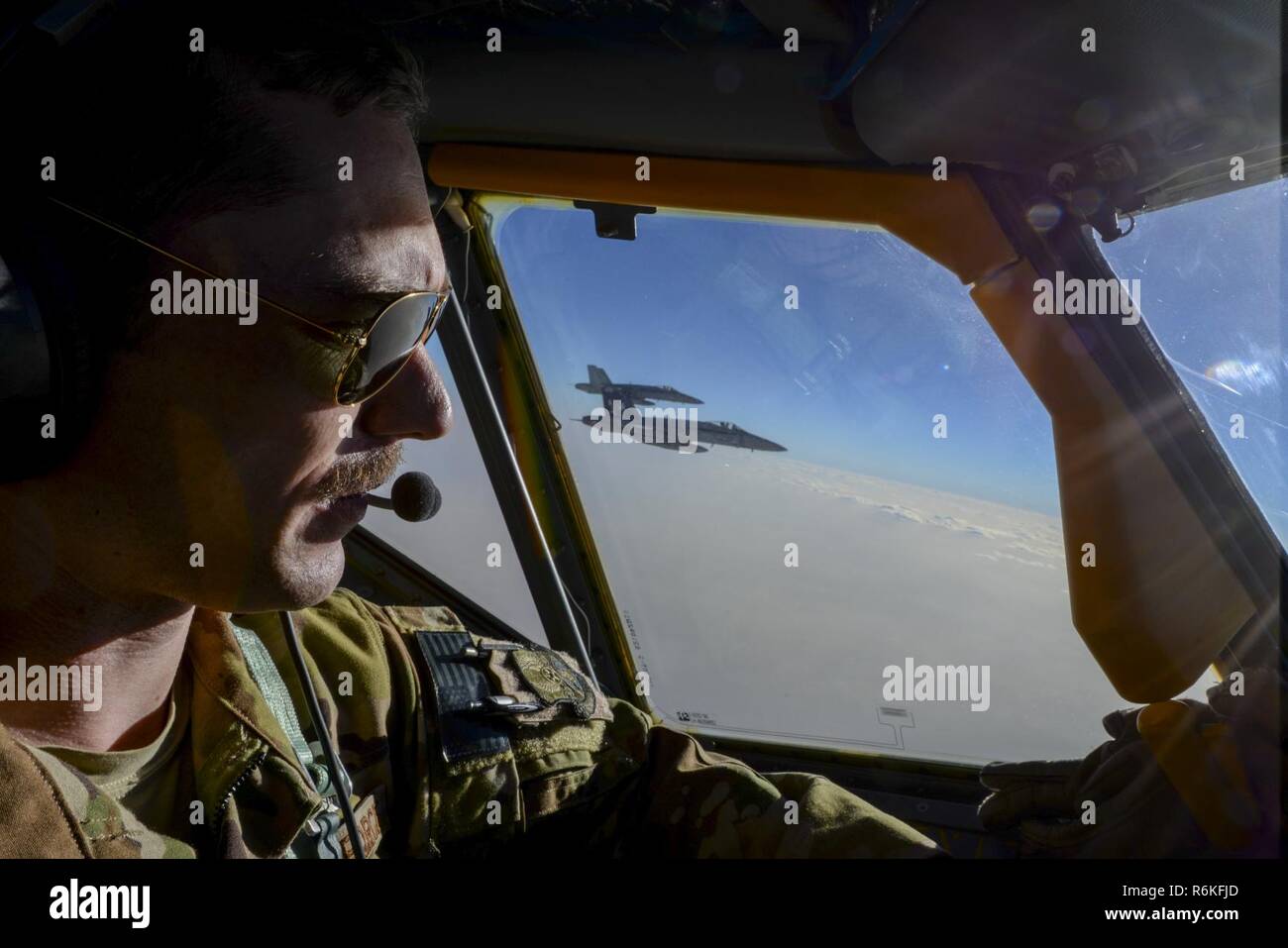 U.S. Air Force Capt. Timothy Black, aircraft commander, pilots a KC-135 ...