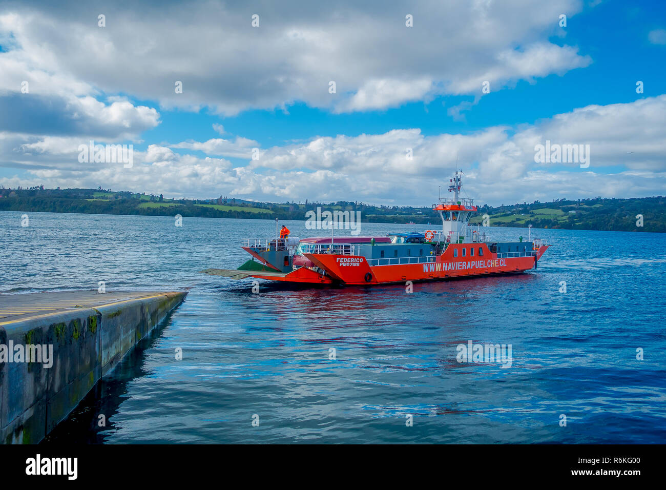 CHILOE, CHILE - SEPTEMBER, 27, 2018: Outdoor view of small red ferry ...
