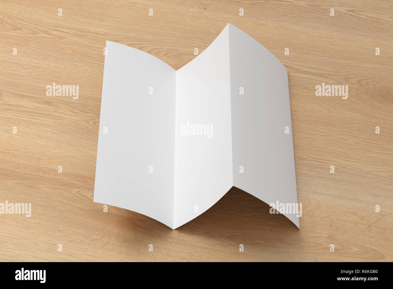 Blank trifold brochure A4 unfolded booklet on wooden background with ...