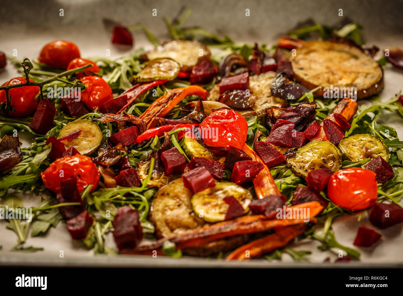 Roasted vegetables with fresh rocket Stock Photo - Alamy
