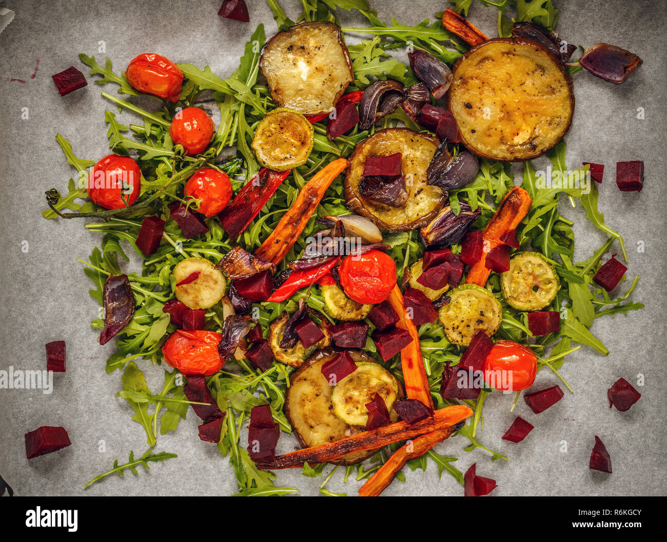 Grilled vegetables on rocket bed Stock Photo - Alamy