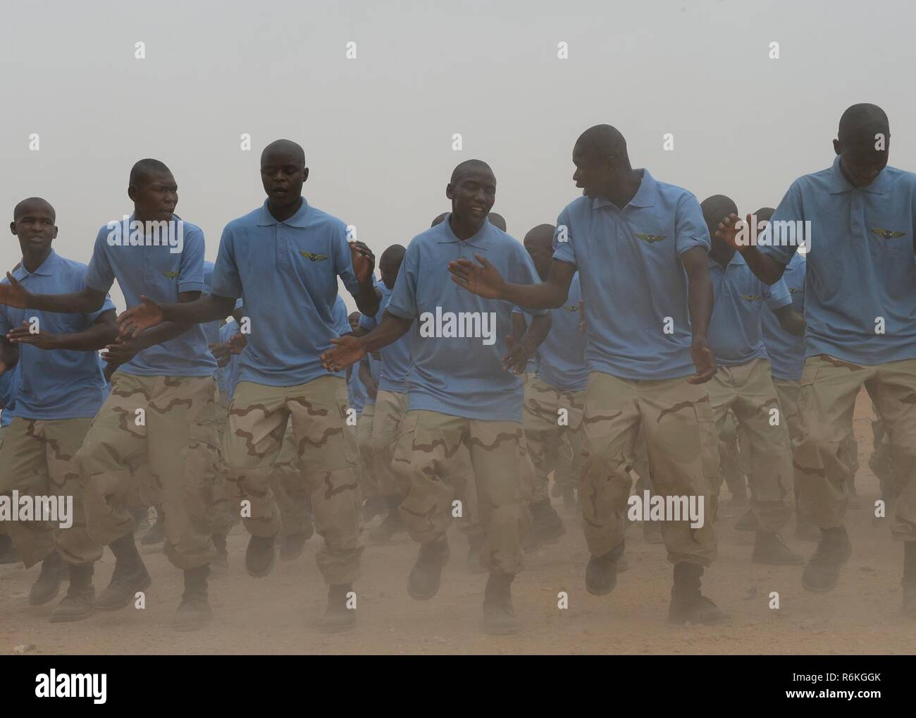 Members of the Forces Armées Nigeriennes chant and dance after their ...