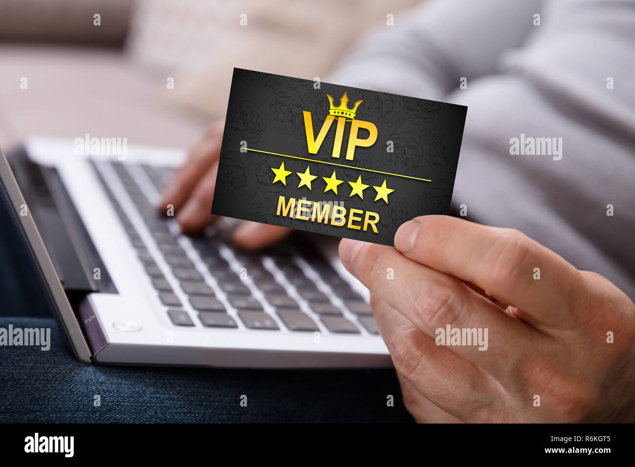 Person Using Laptop Holding Vip Member Card Stock Photo - Alamy