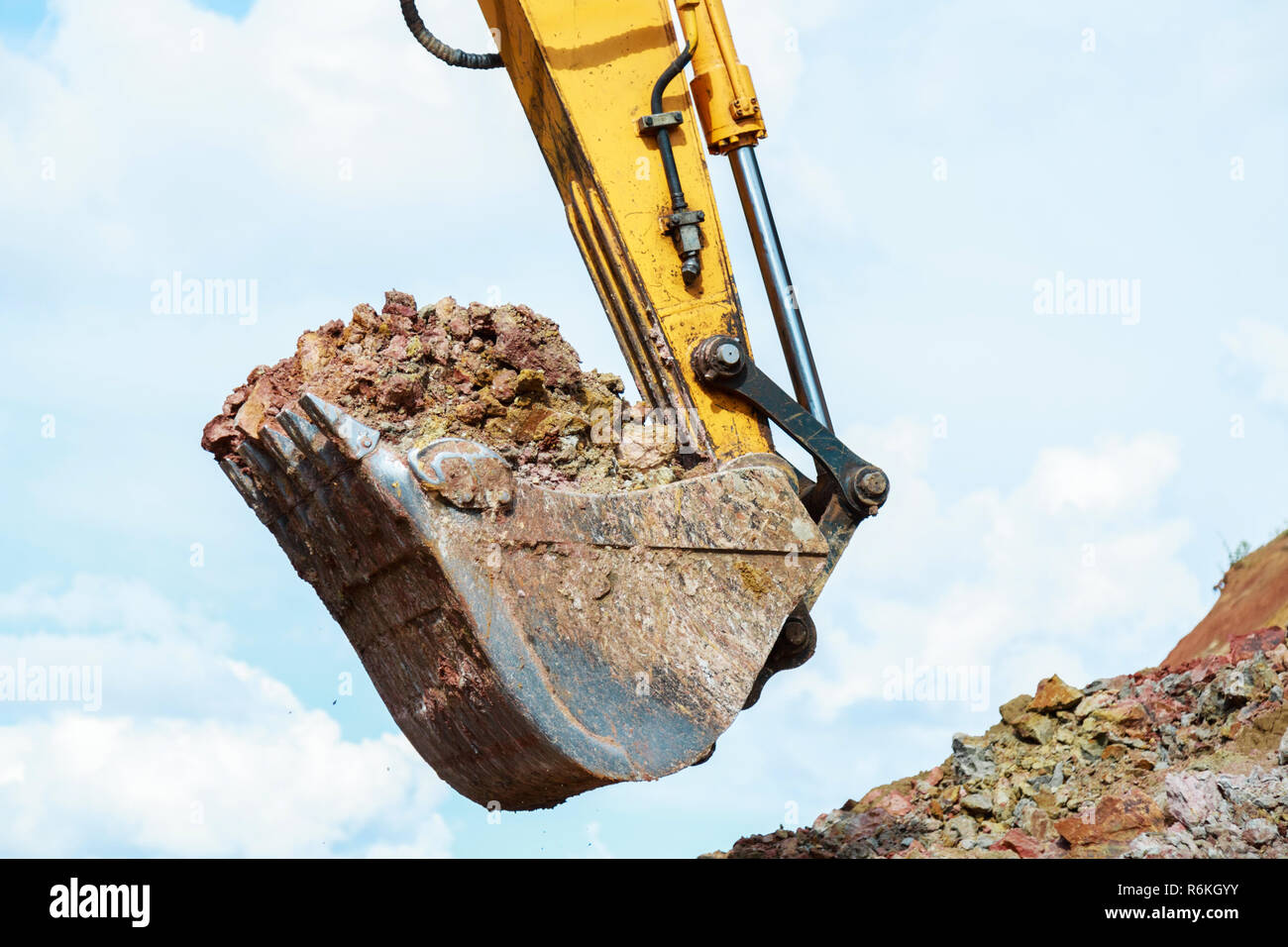 Excavator bucket with ground closeup Stock Photo - Alamy
