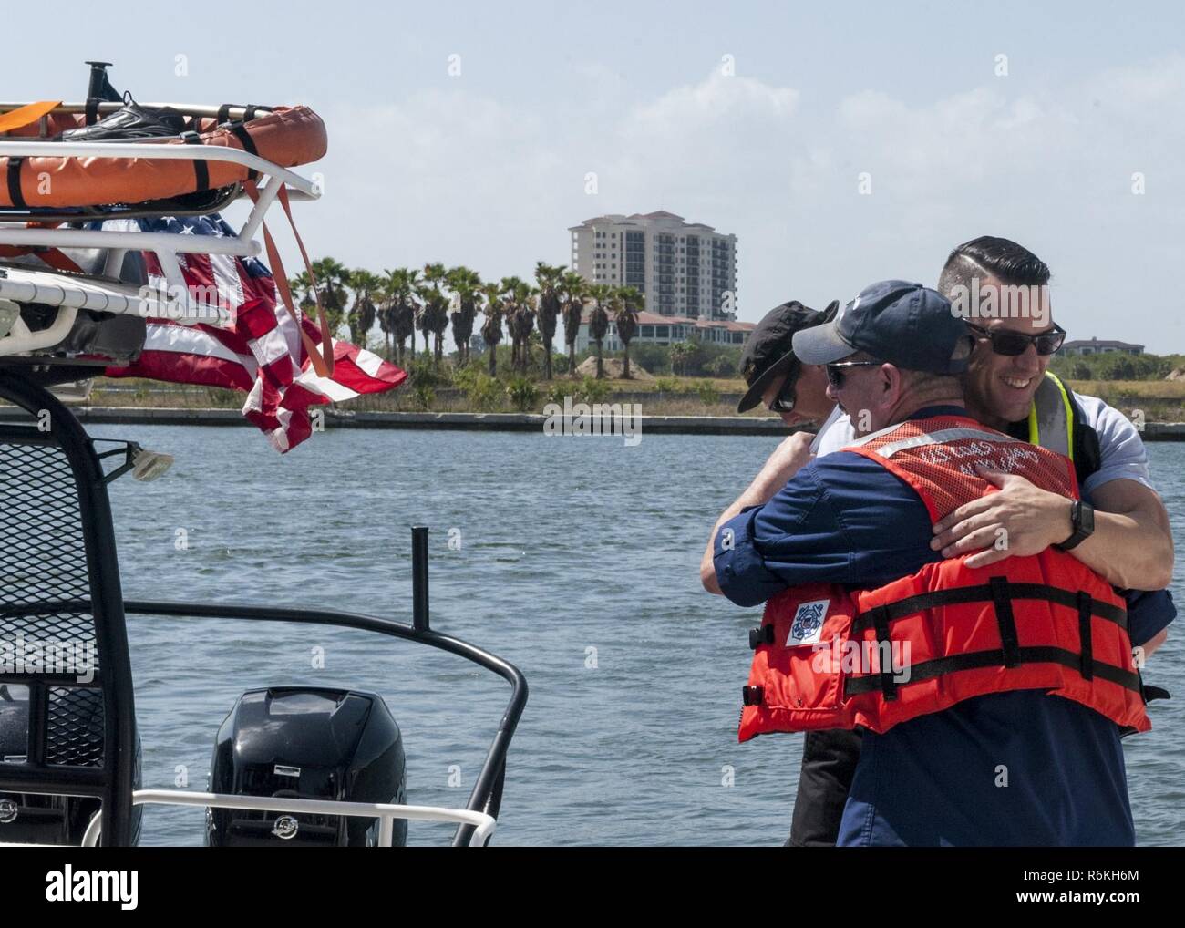 Darren Hart, member of Coast Guard Auxiliary Flotilla 7-9, greets one ...
