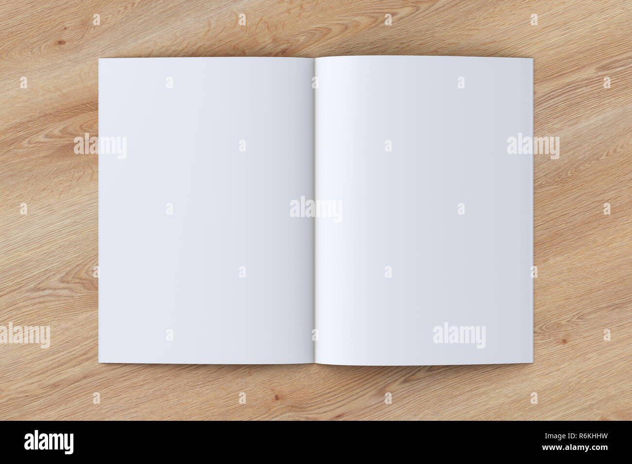 Open blank booklet on wooden background with clipping path around ...