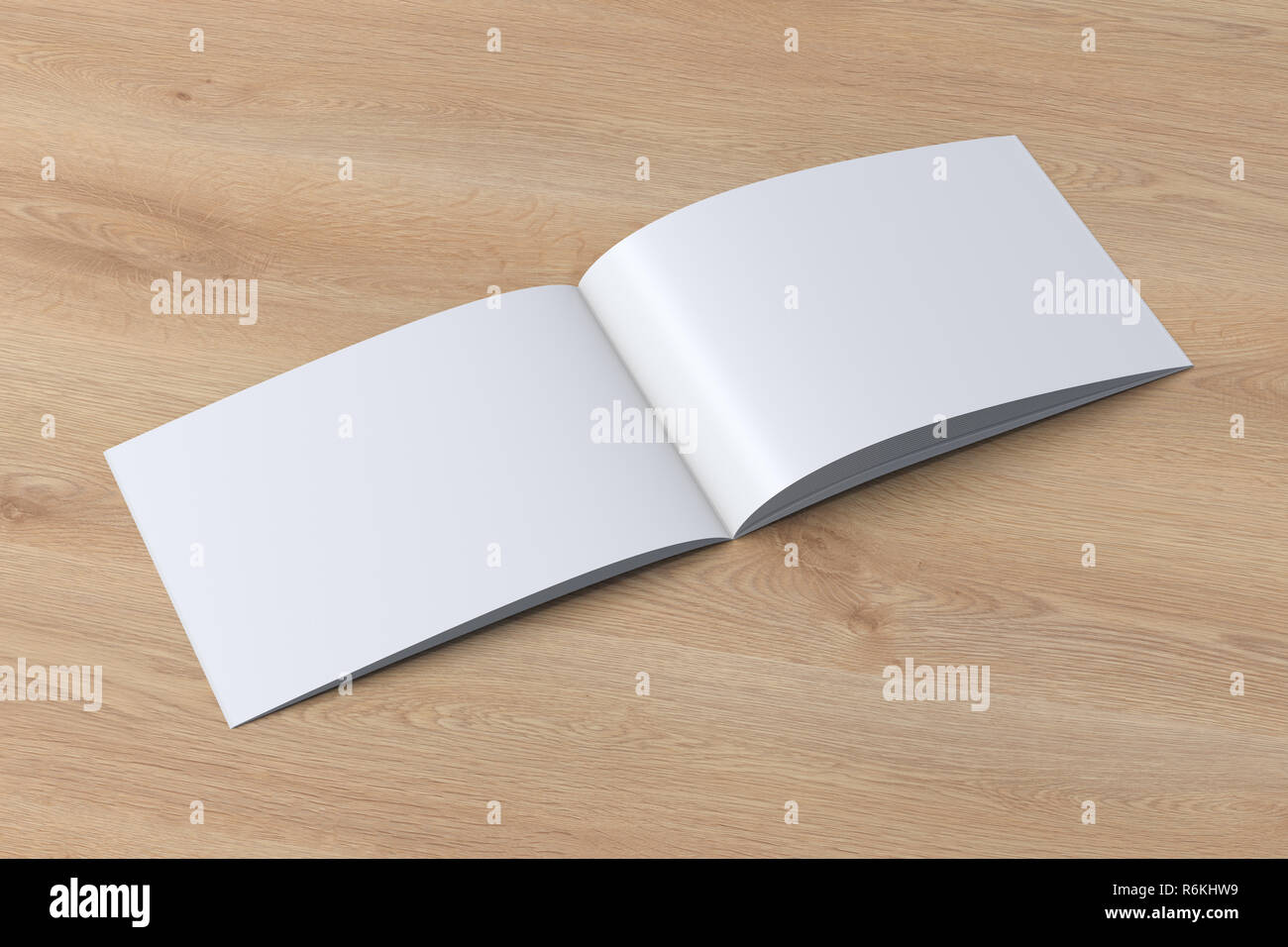 Open blank horizontal booklet on wooden background with clipping path ...