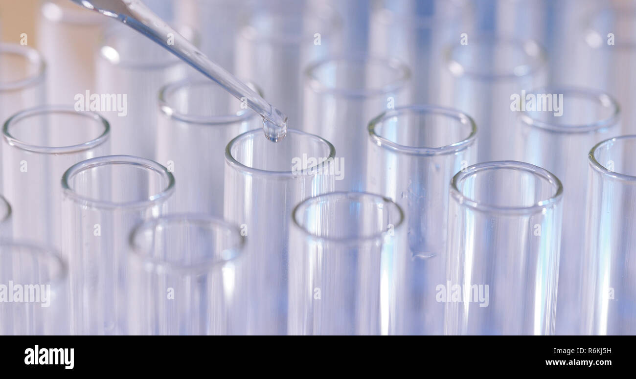 Chemist doing science experiment with chemicals Stock Photo - Alamy