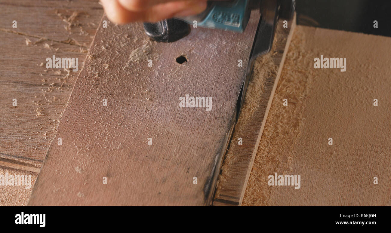 Wood grinder by electric hand router Stock Photo - Alamy