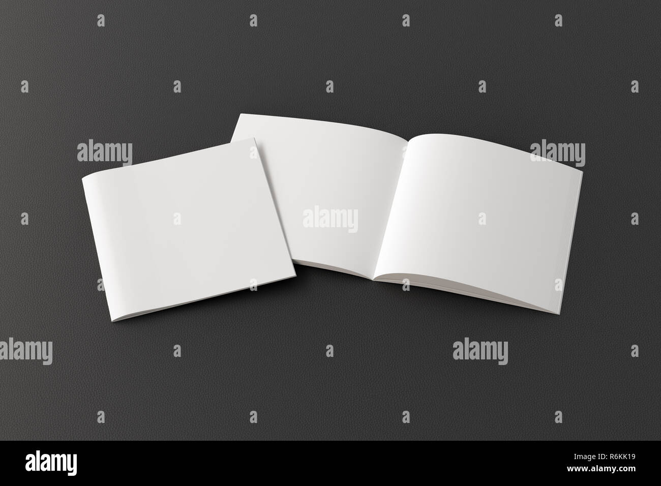 Open and closed square blank booklet on black background with clipping ...