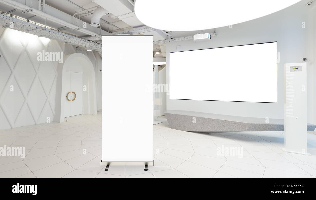 Blank roll up banner stand and info display in office lobby interior ...
