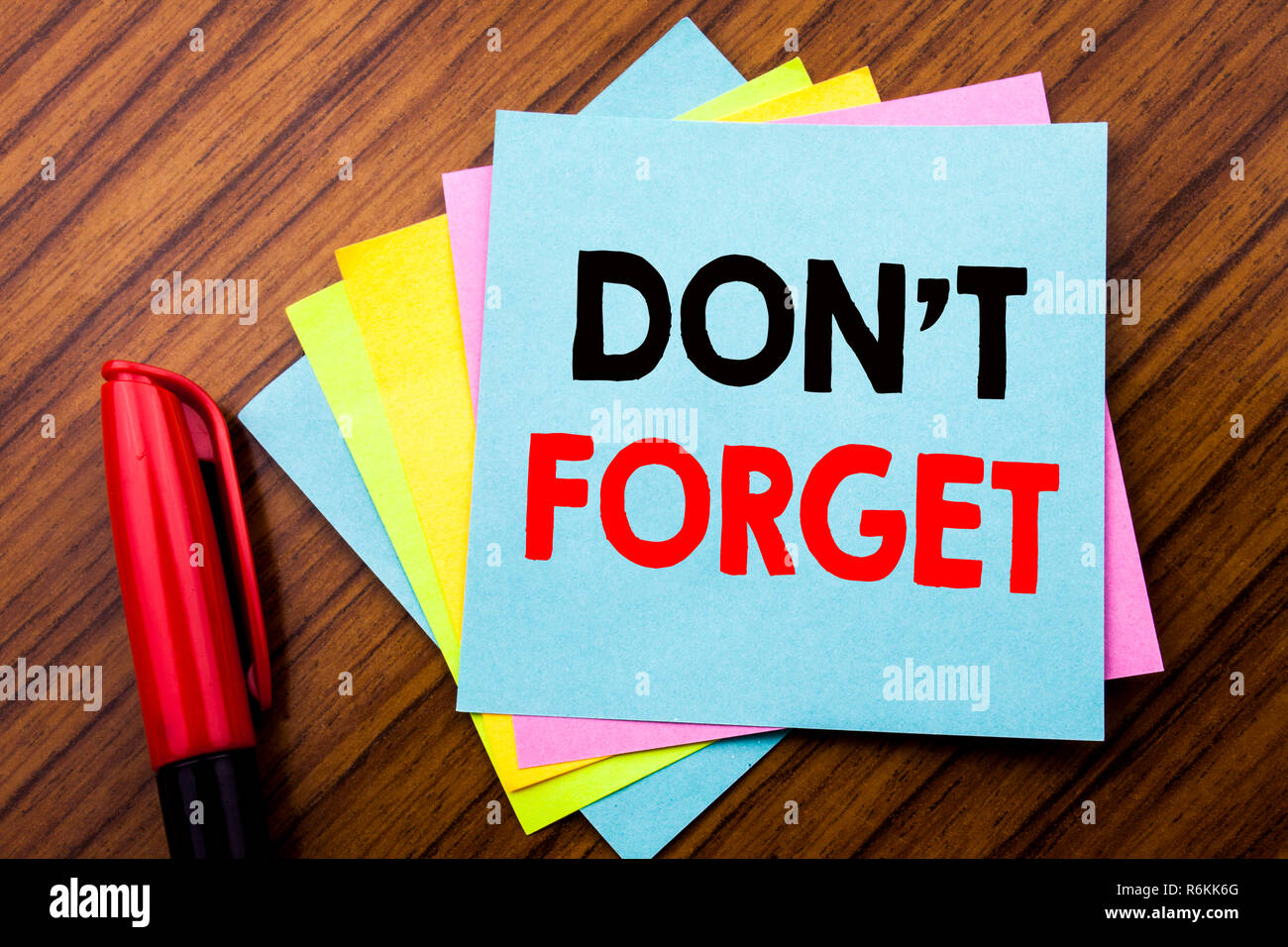 Dont forget written on yellow post it note hi-res stock photography and ...