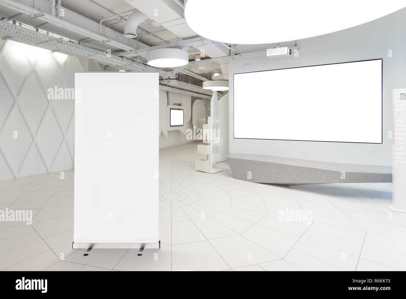 Blank roll up banner stand and info display in office lobby interior ...