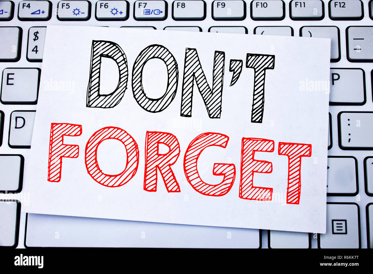 Handwritten text caption showing Do Not Forget. Business concept ...