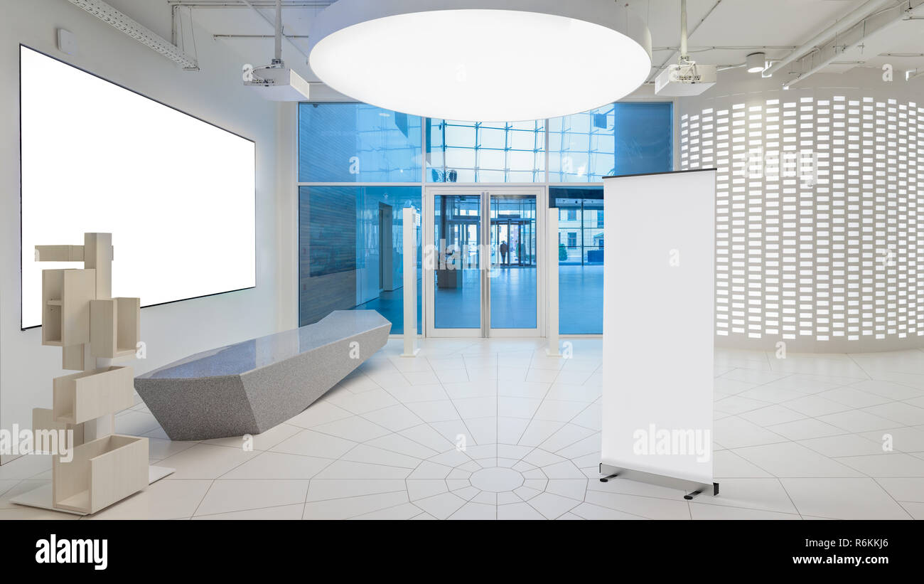 Blank roll up banner stand and info display in office lobby interior ...
