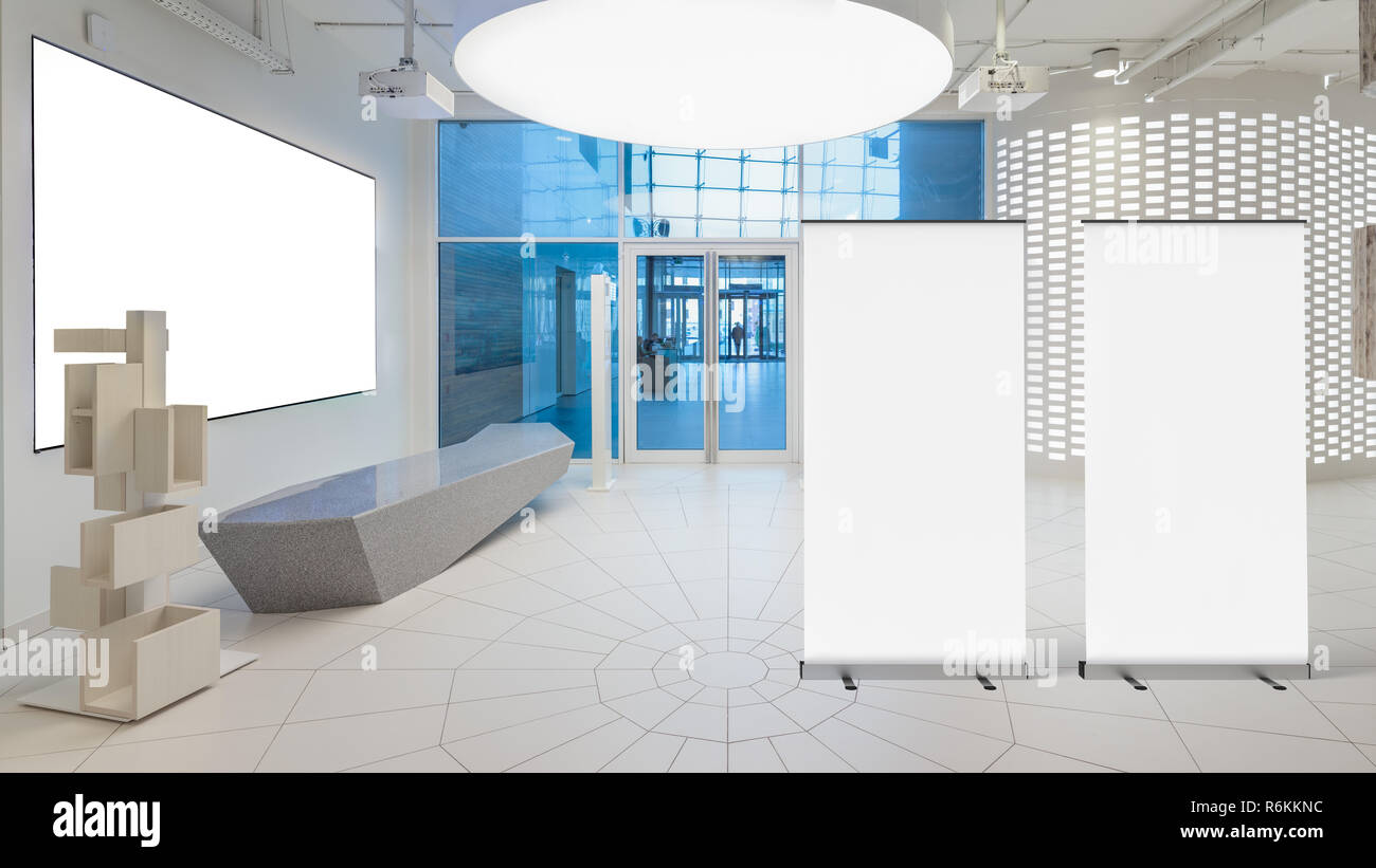 Two blank roll up banner stand and info display in office lobby ...