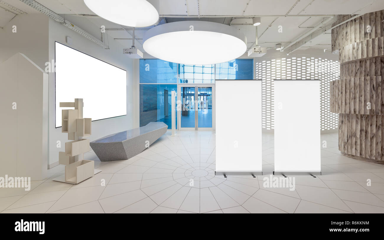 Two blank roll up banner stand and info display in office lobby ...