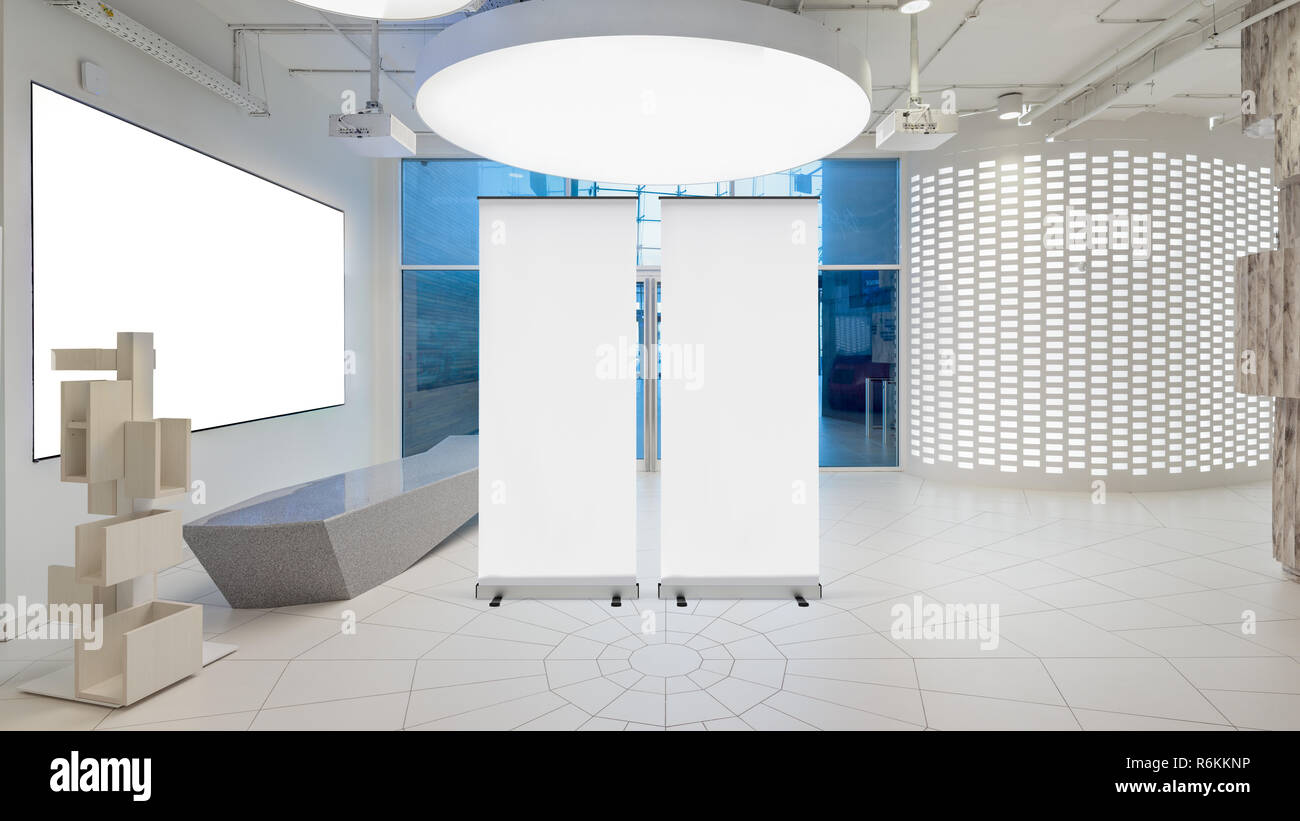 Two blank roll up banner stand and info display in office lobby ...