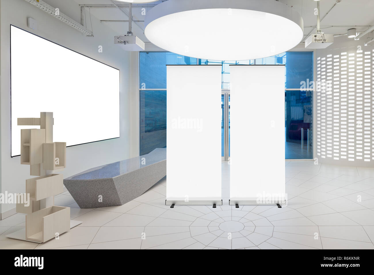 Two blank roll up banner stand and info display in office lobby ...