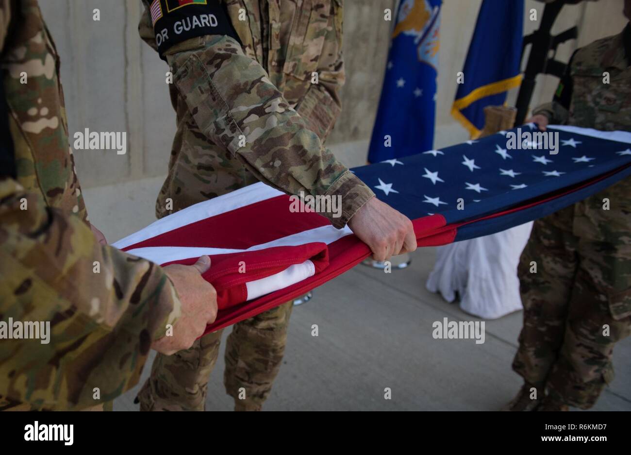 Bagram Honor Guard members fold the American flag during a Memorial Day ...