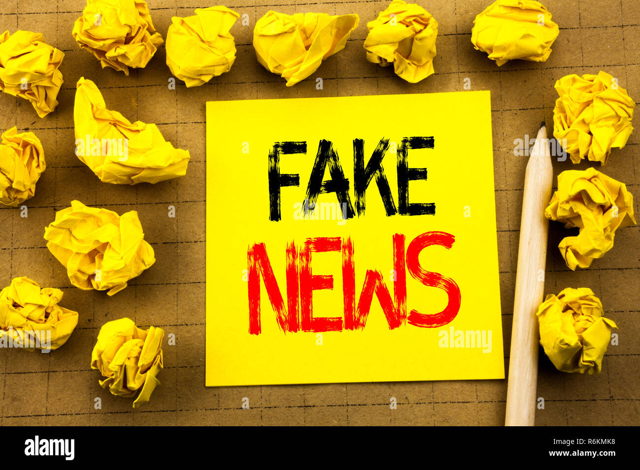 Fake News. Business concept for Hoax Journalism written on sticky note ...