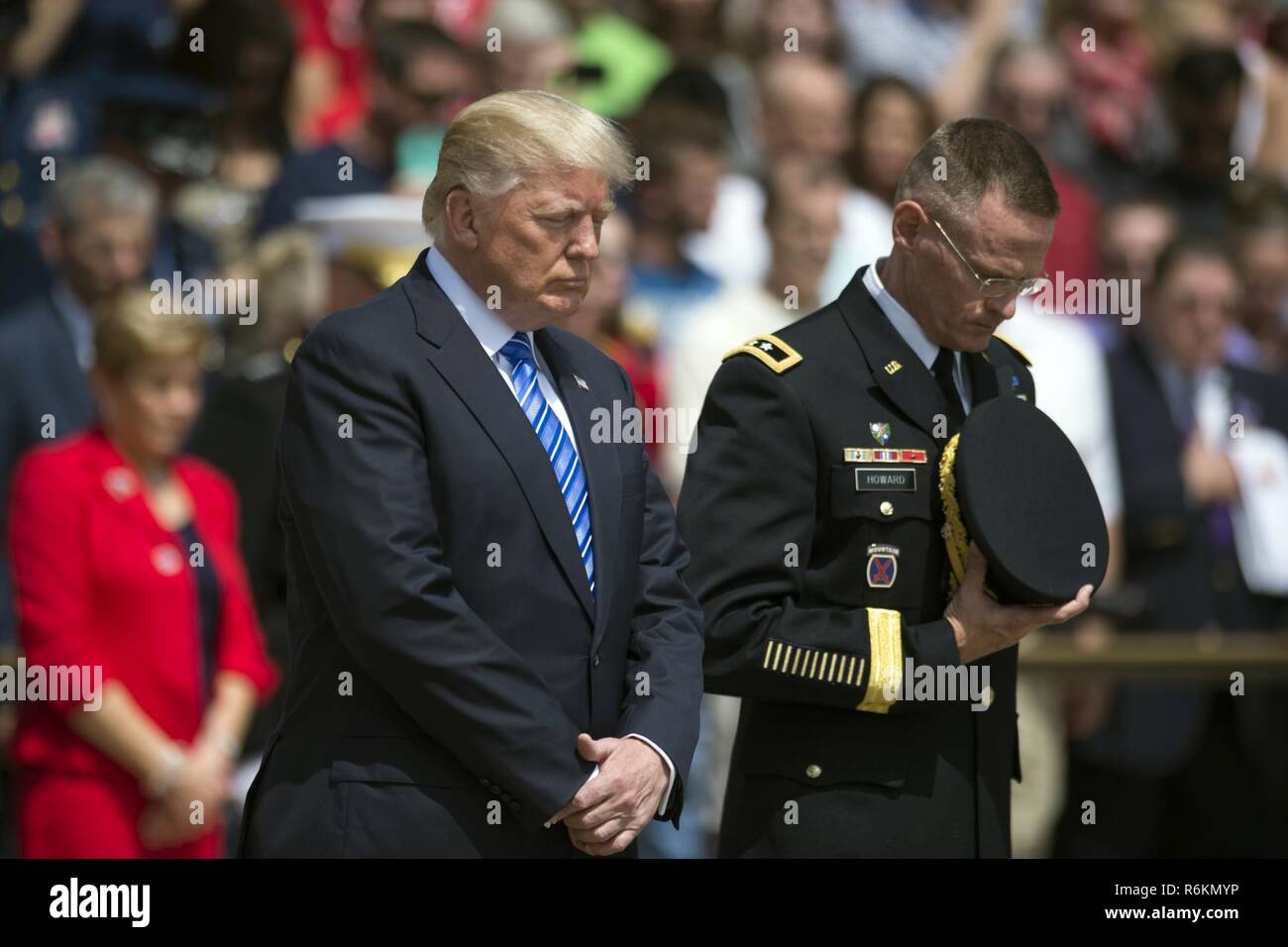 President Donald J. Trump and Maj. Gen. Michael L. Howard bow their ...