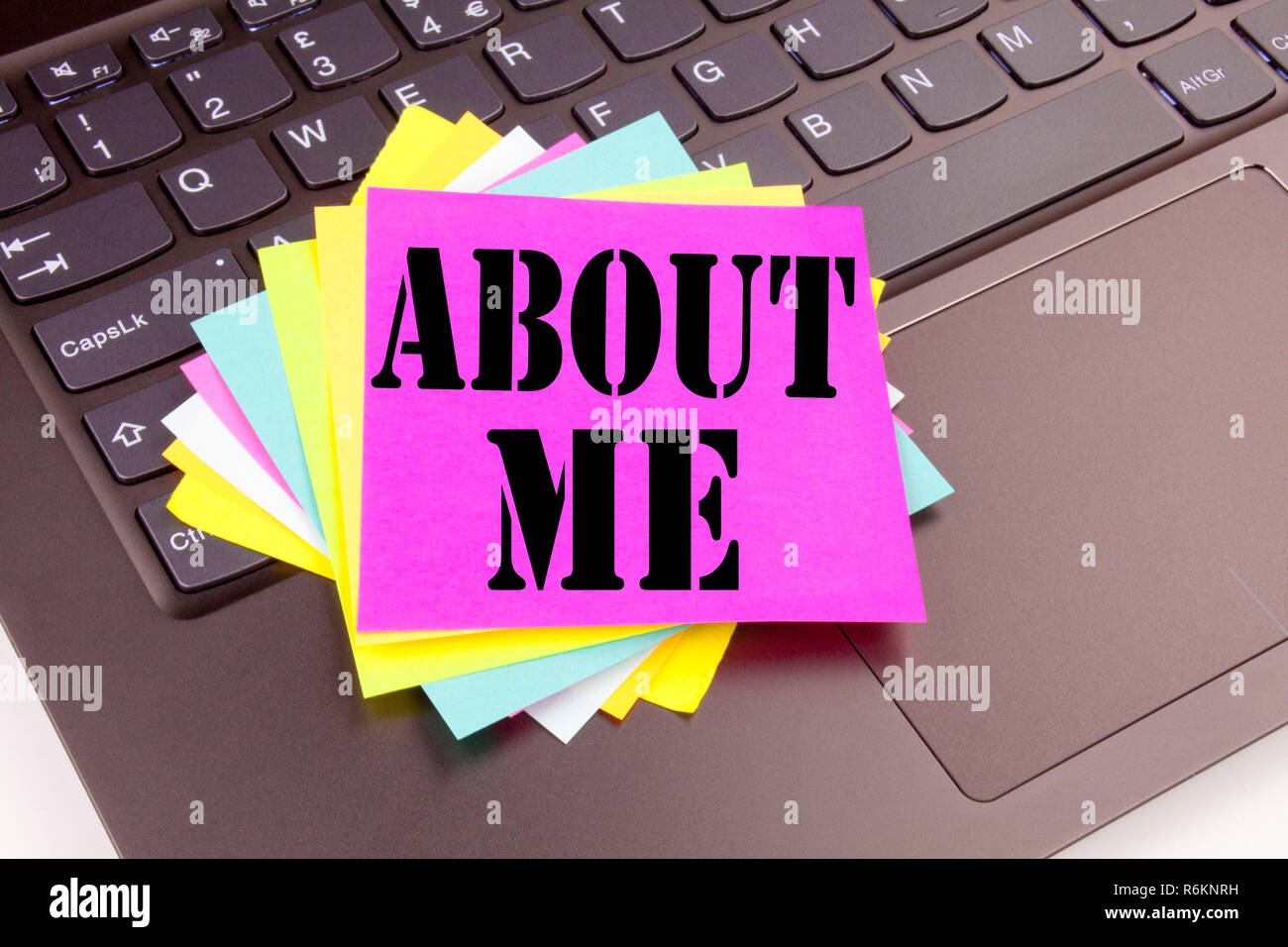 Writing About Me text made in the office close-up on laptop computer ...