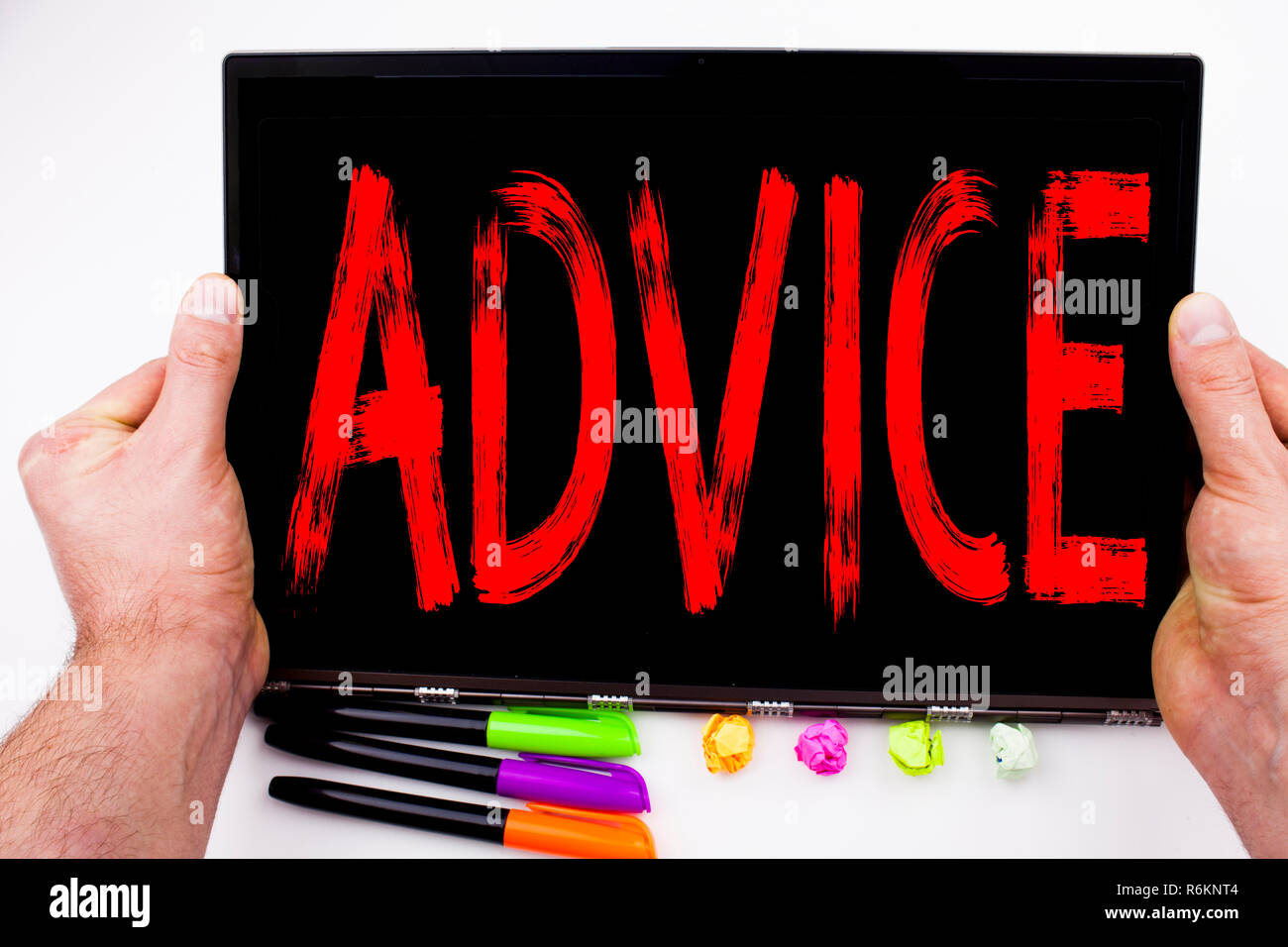 Advice text written on tablet, computer in the office with marker, pen ...