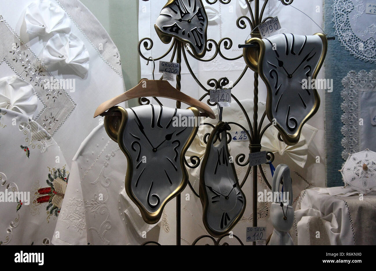 Melted clocks used as a window display in Venice Stock Photo - Alamy
