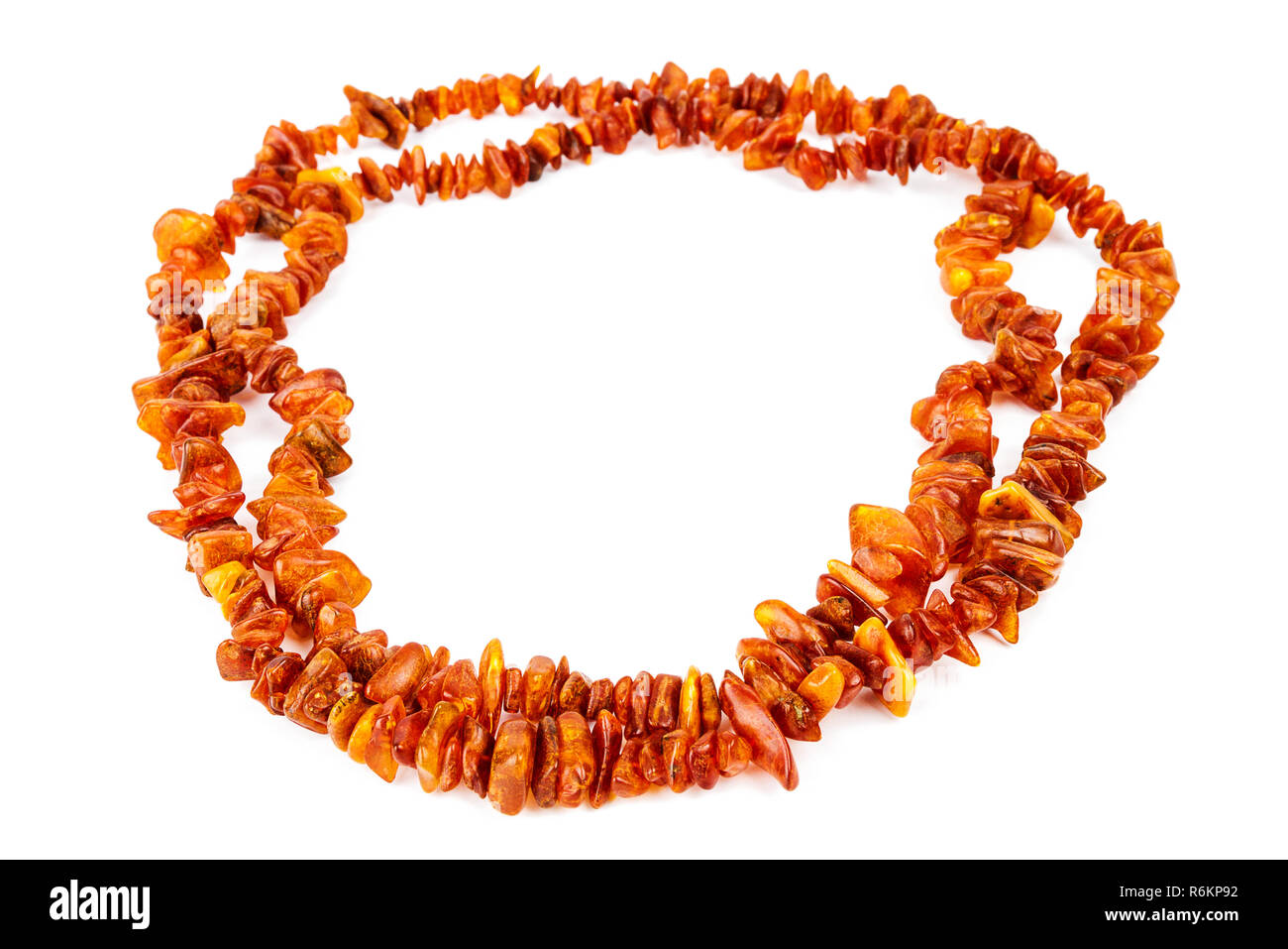 String of baltic amber beads isolated on white background. Bright ...